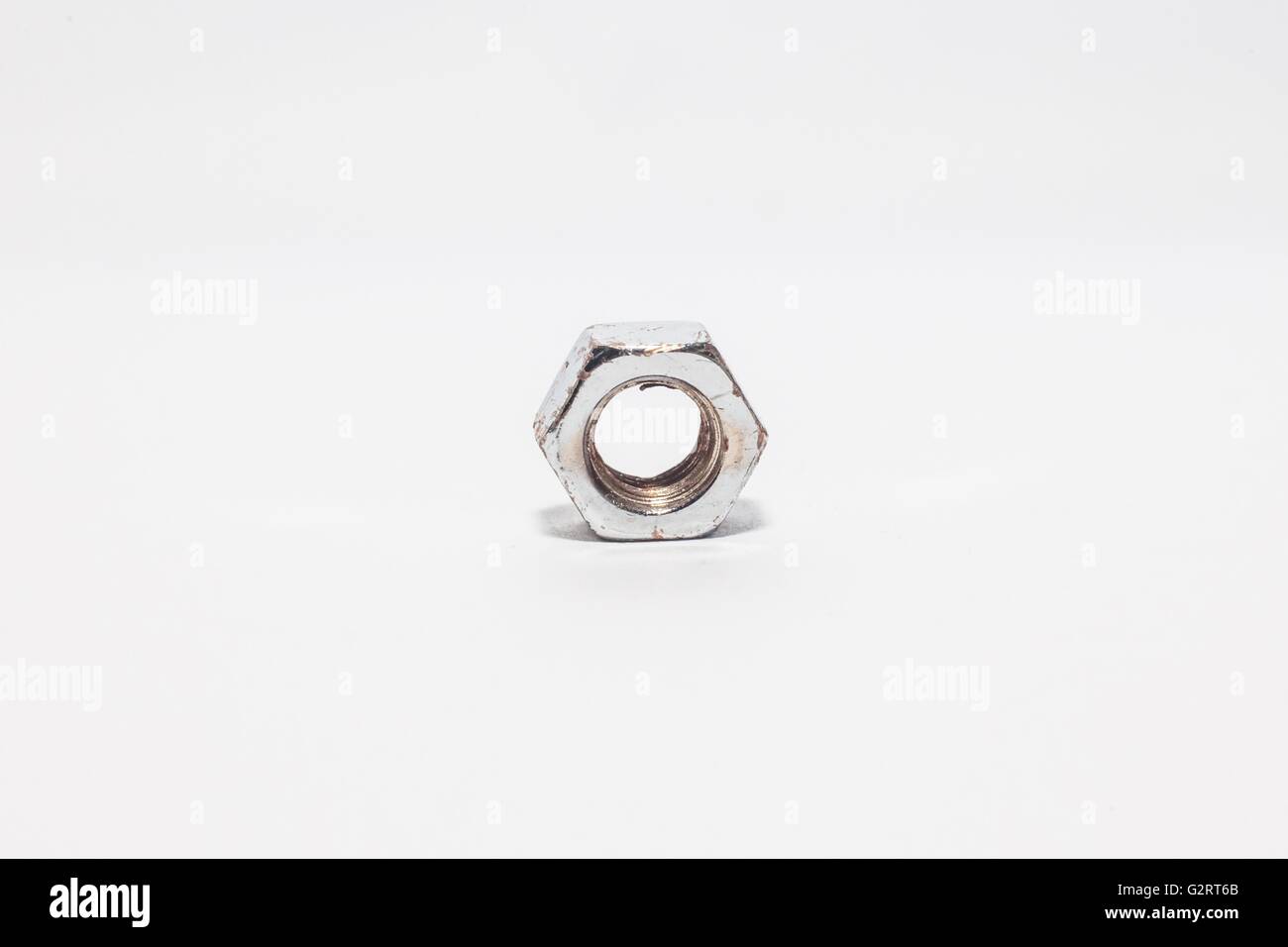 Used and new nuts for manufacturing and industry with white background ...