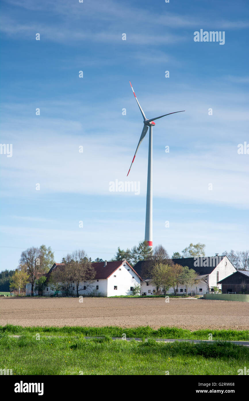 Alternative energy with a windmill at a farm Stock Photo - Alamy