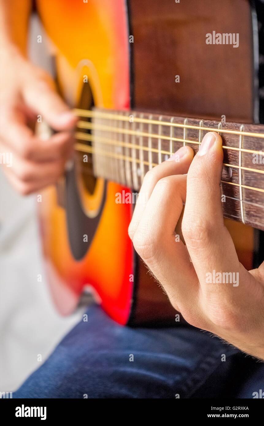 close up of hands playing acoustic guitar Stock Photo - Alamy