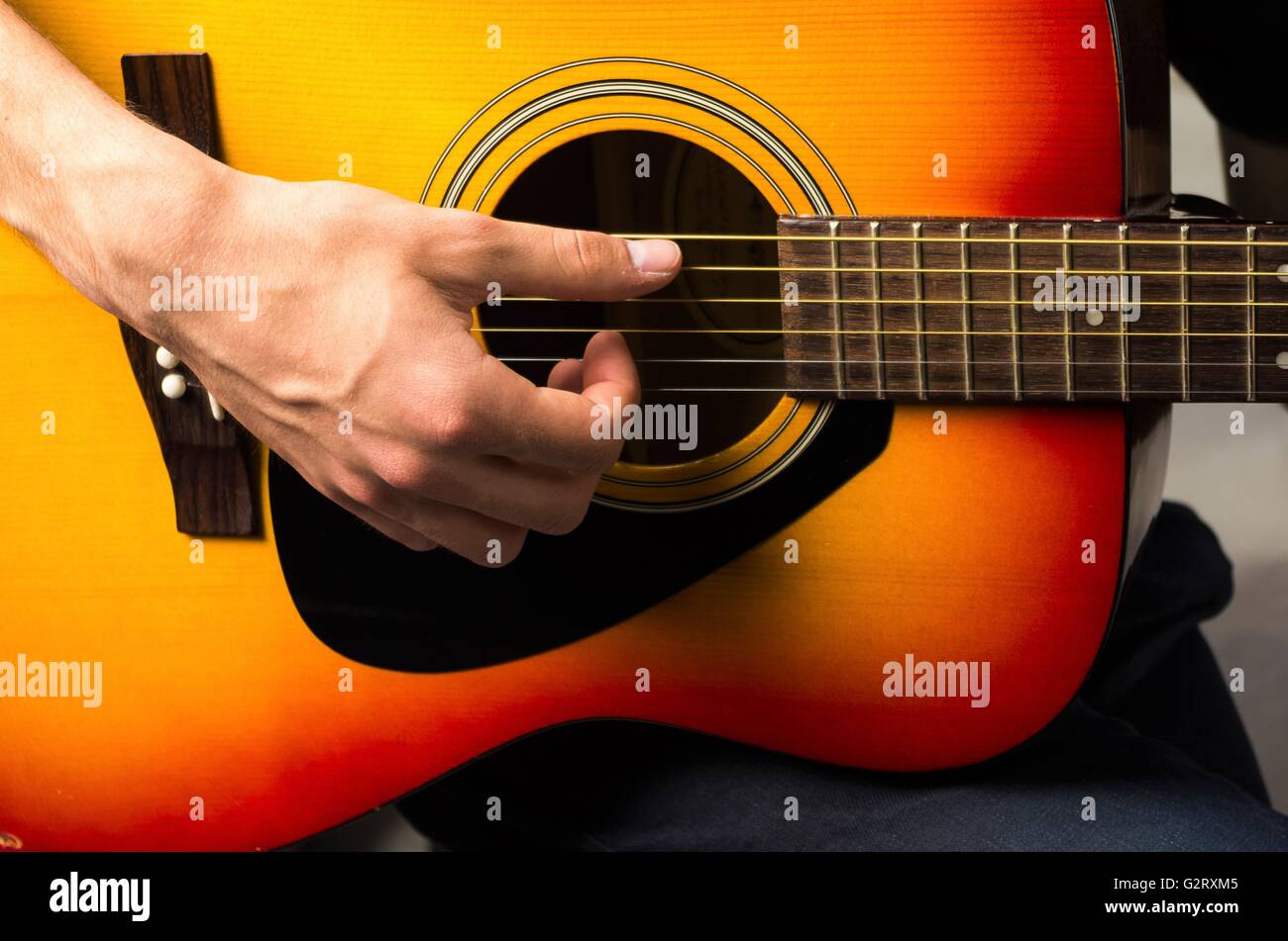 close up of hands playing acoustic guitar Stock Photo - Alamy