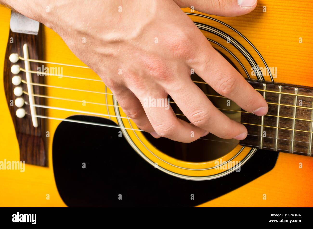 close up of hands playing acoustic guitar Stock Photo - Alamy