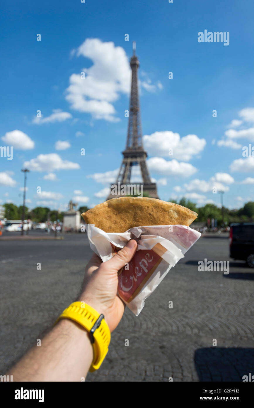 A famous chocolate crepe and the Eiffel Tower in the background, Paris ...