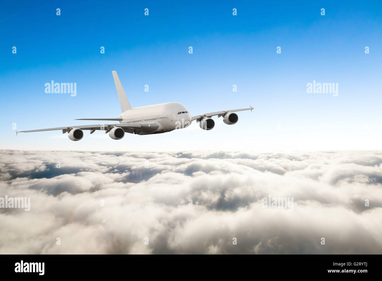 Commercial jet plane flying above clouds in day light Stock Photo - Alamy