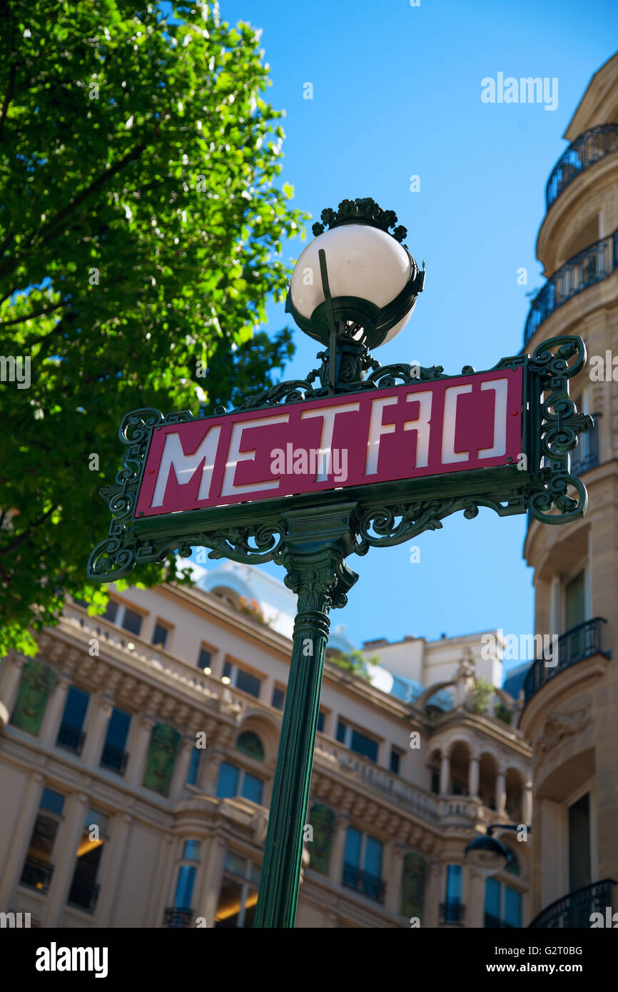 Traditional Paris metro sign with trees in the background Stock Photo ...