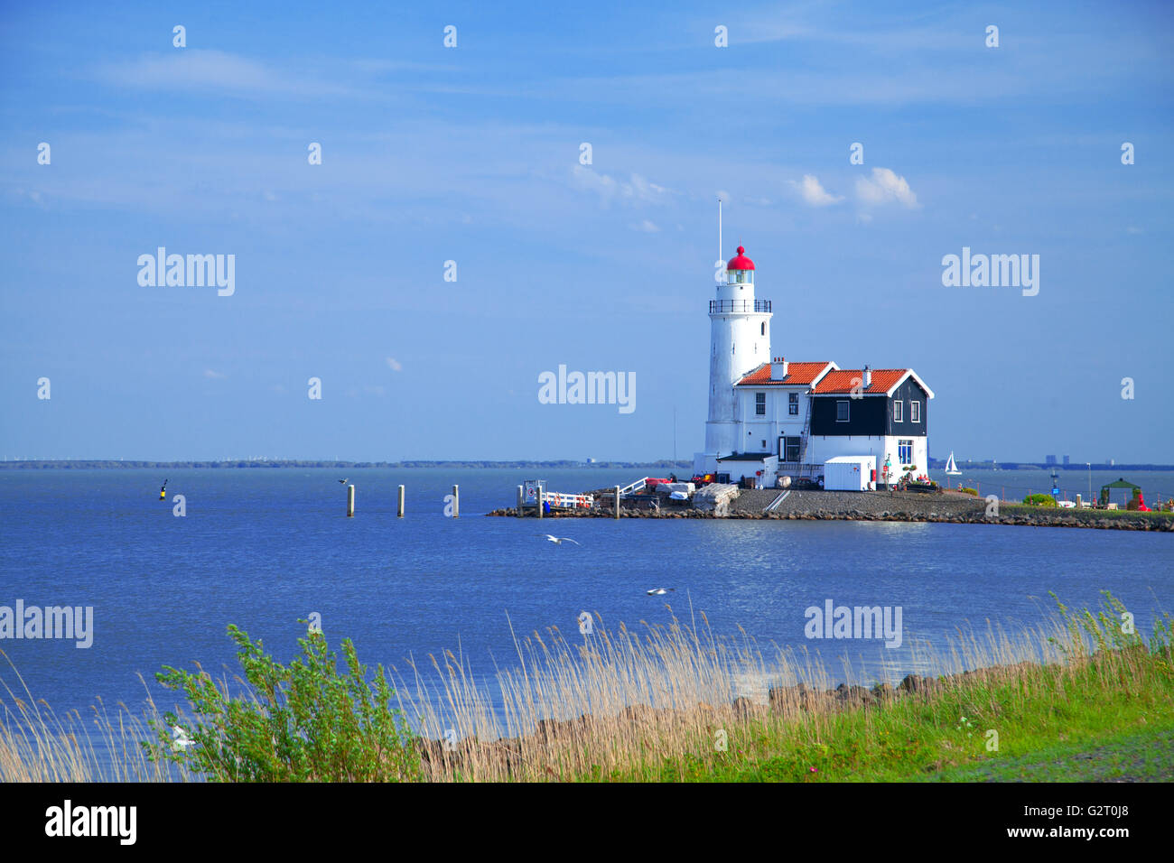 lighthouse in Marken is on the coast of the Sea in Europe Stock Photo ...