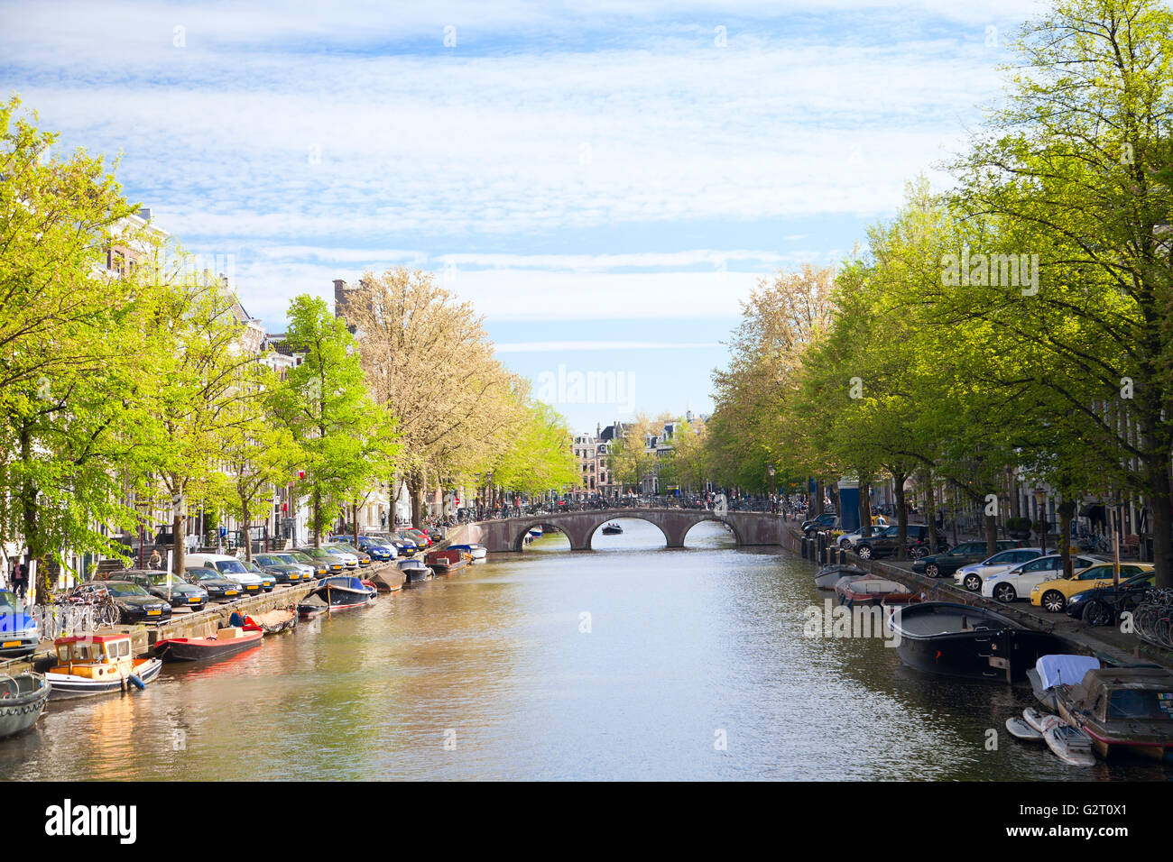 sunny summer day in Amsterdam. floating houses on the canals and ...