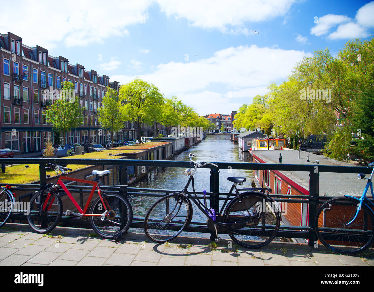 sunny summer day in Amsterdam. floating houses on the canals and ...