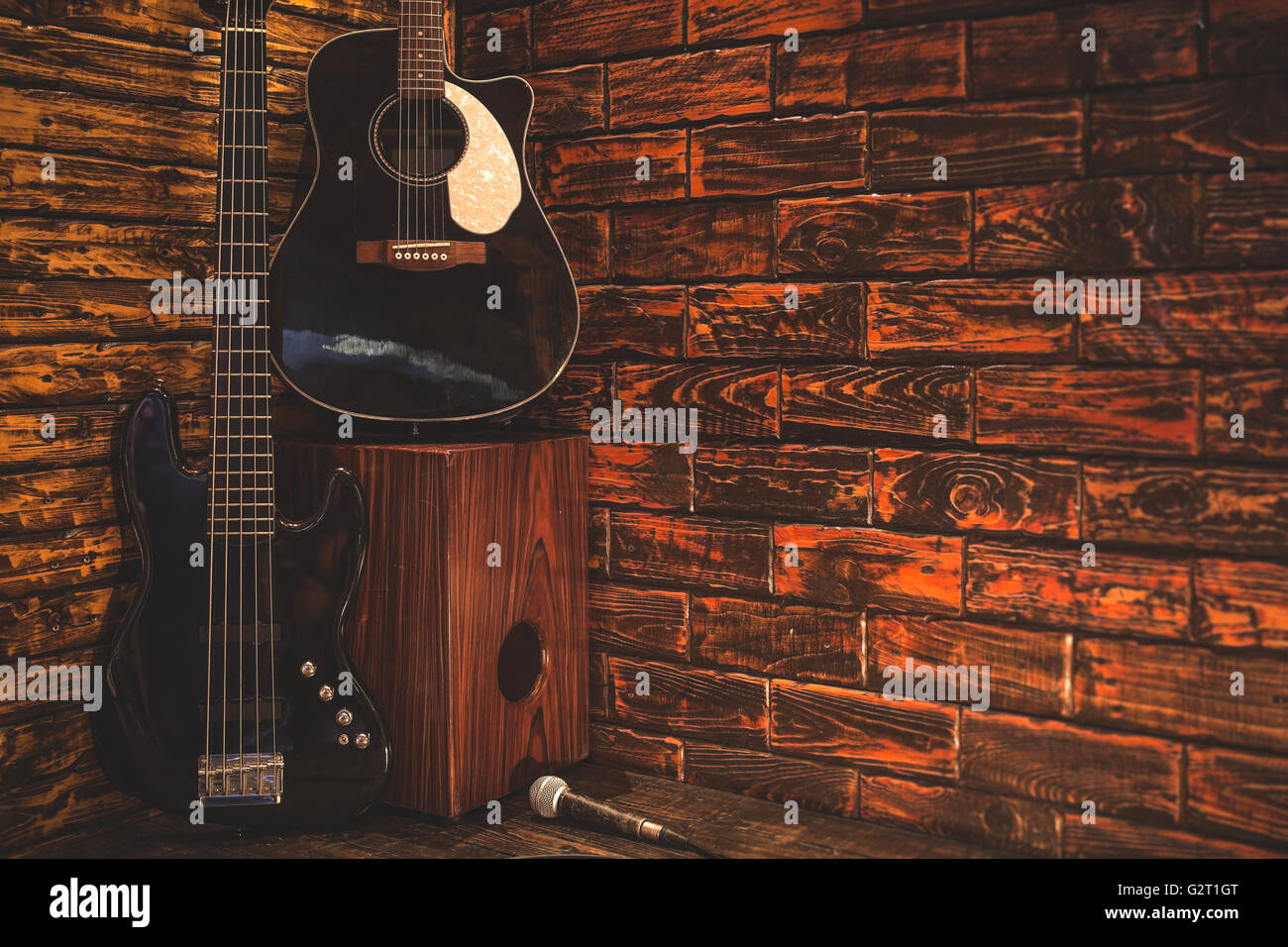Music instrument on wooden stage in Pub Stock Photo - Alamy