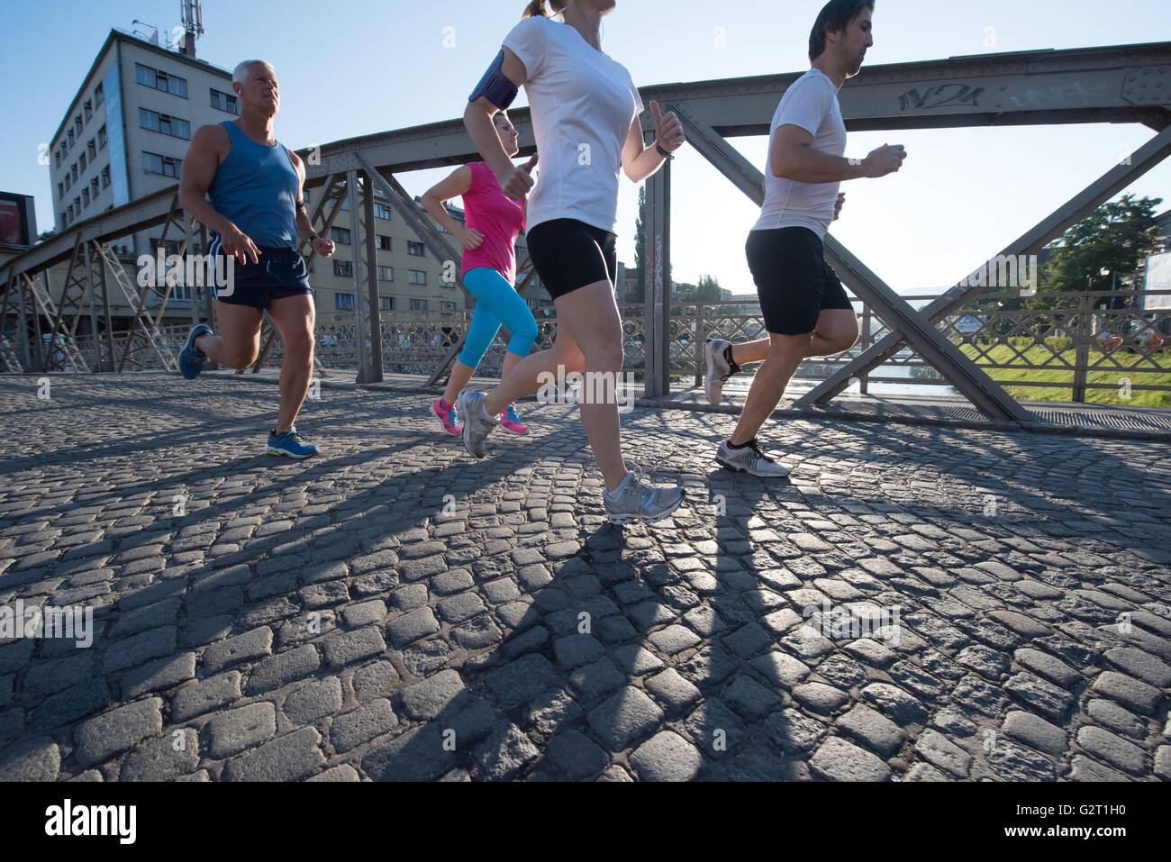people group jogging runners team on morning training workout with ...