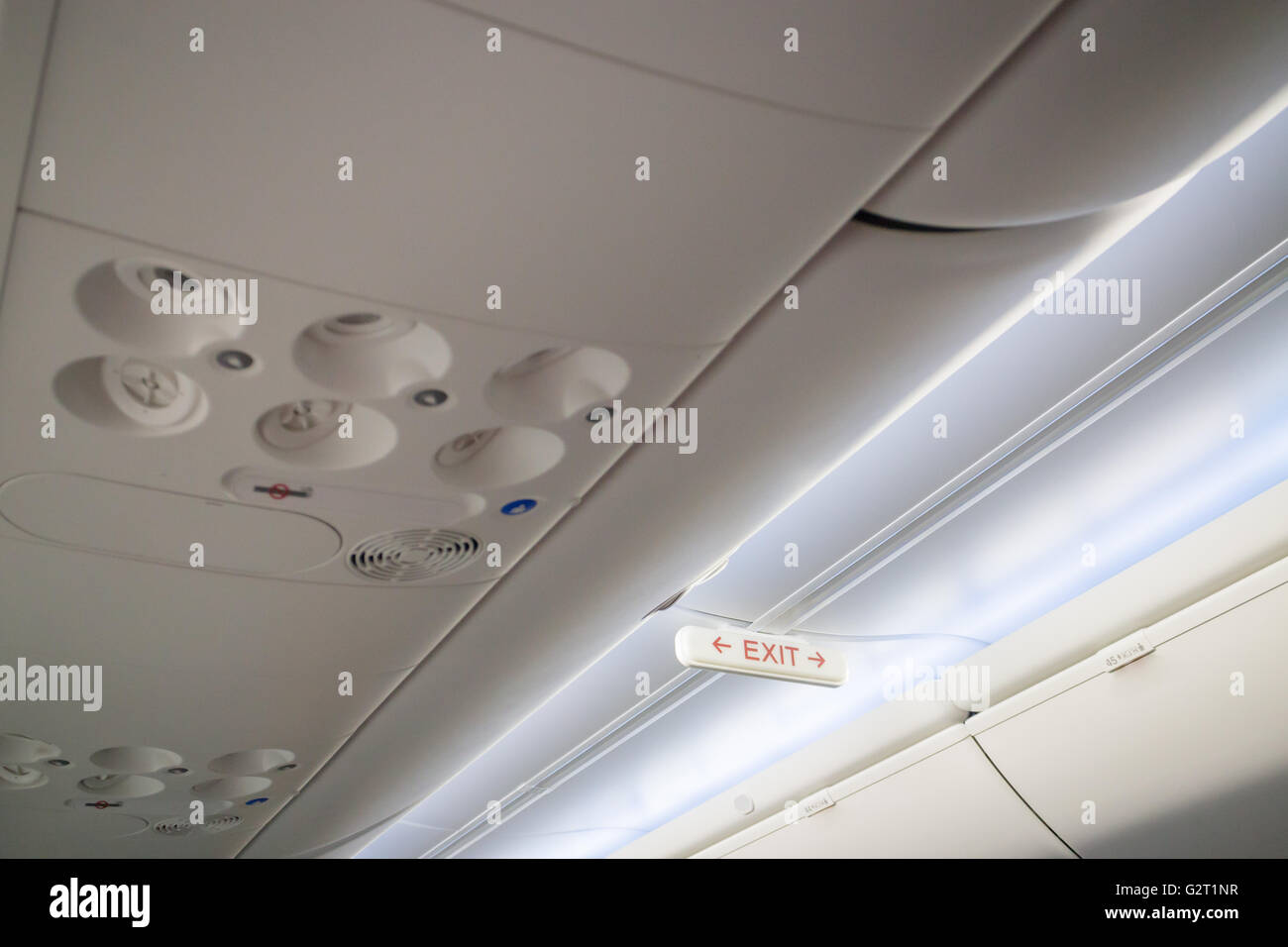 Airplane cabin interior exit sign hi-res stock photography and images ...