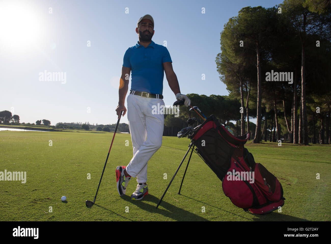 handsome middle eastern golf player portrait at course on beautiful ...