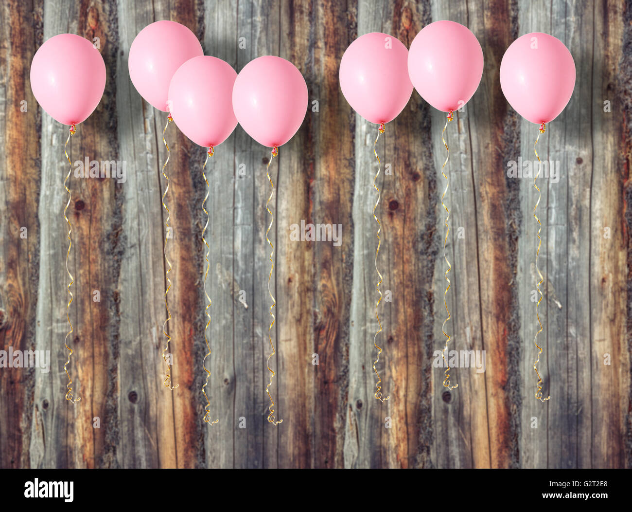 Red air flying balloons on wooden background Stock Photo - Alamy