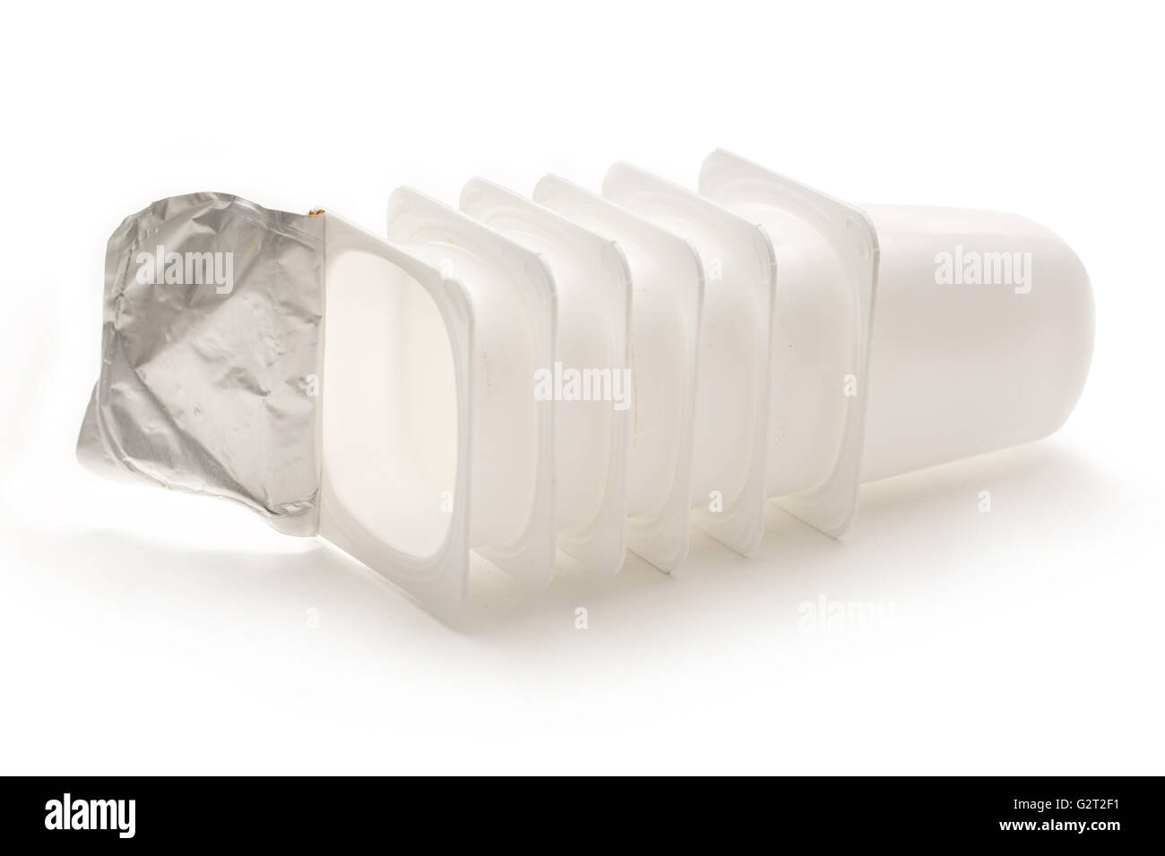 Empty plastic yogurt pots on white backround Stock Photo - Alamy