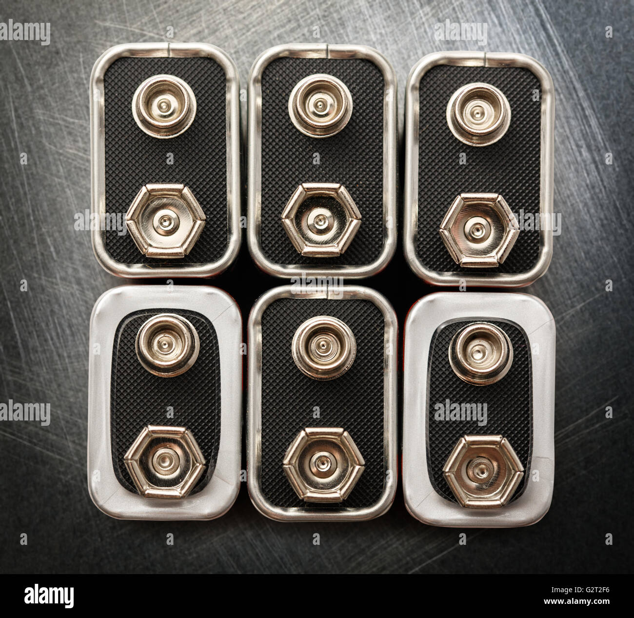 Group of many batterys on metal background in closeup Stock Photo - Alamy