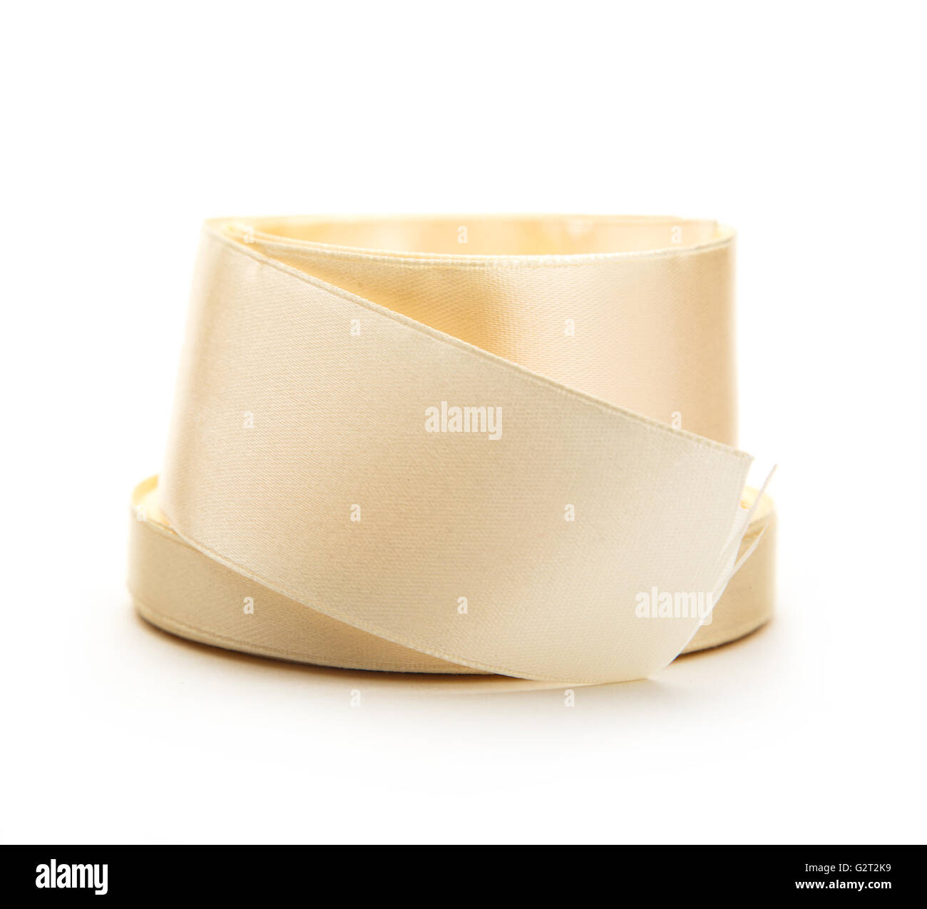 Cream ribbon in roll on white background Stock Photo - Alamy