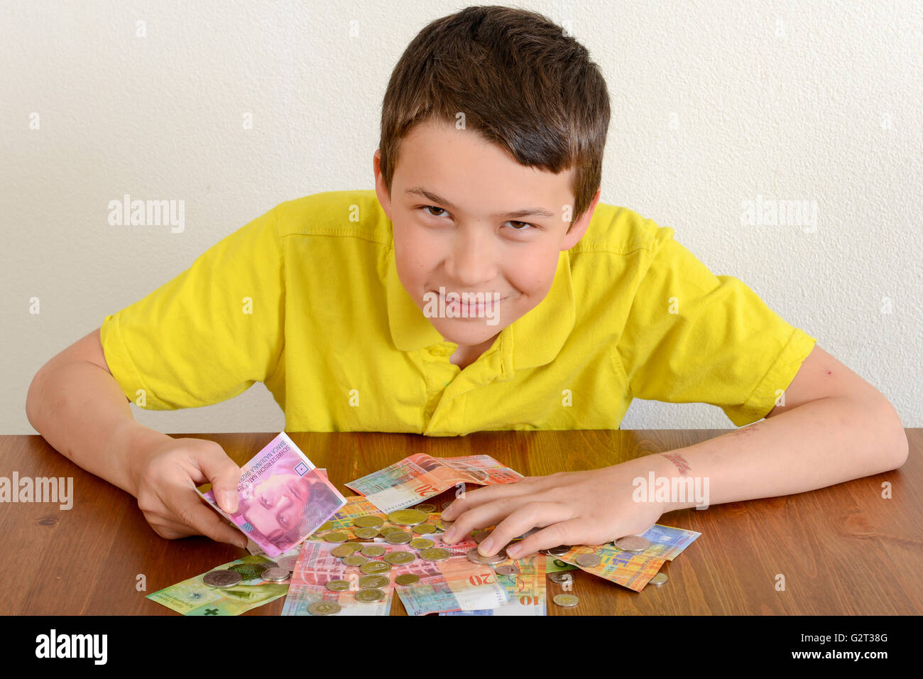Child showing proudly his money Stock Photo - Alamy
