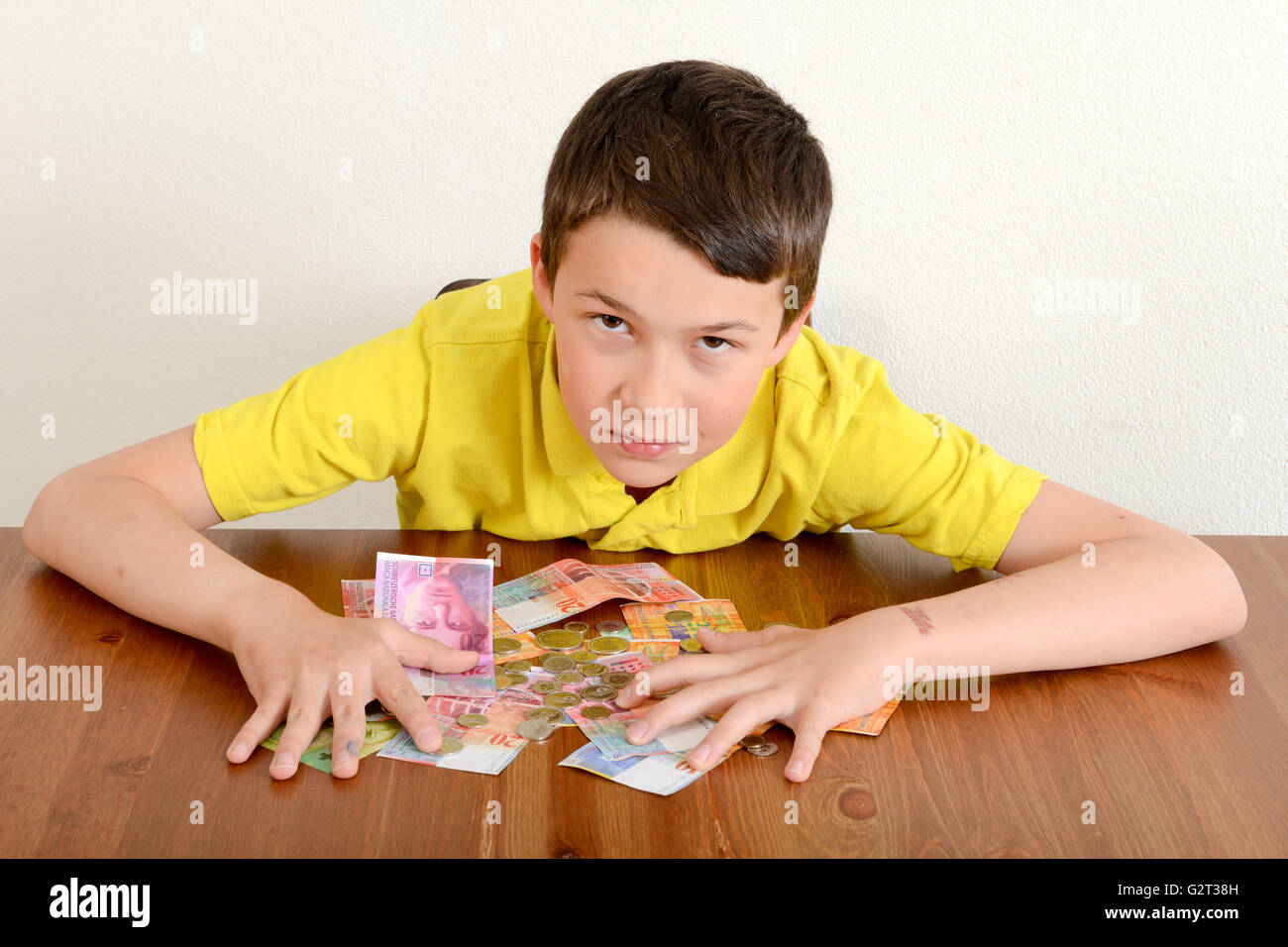 Child showing proudly his money Stock Photo - Alamy
