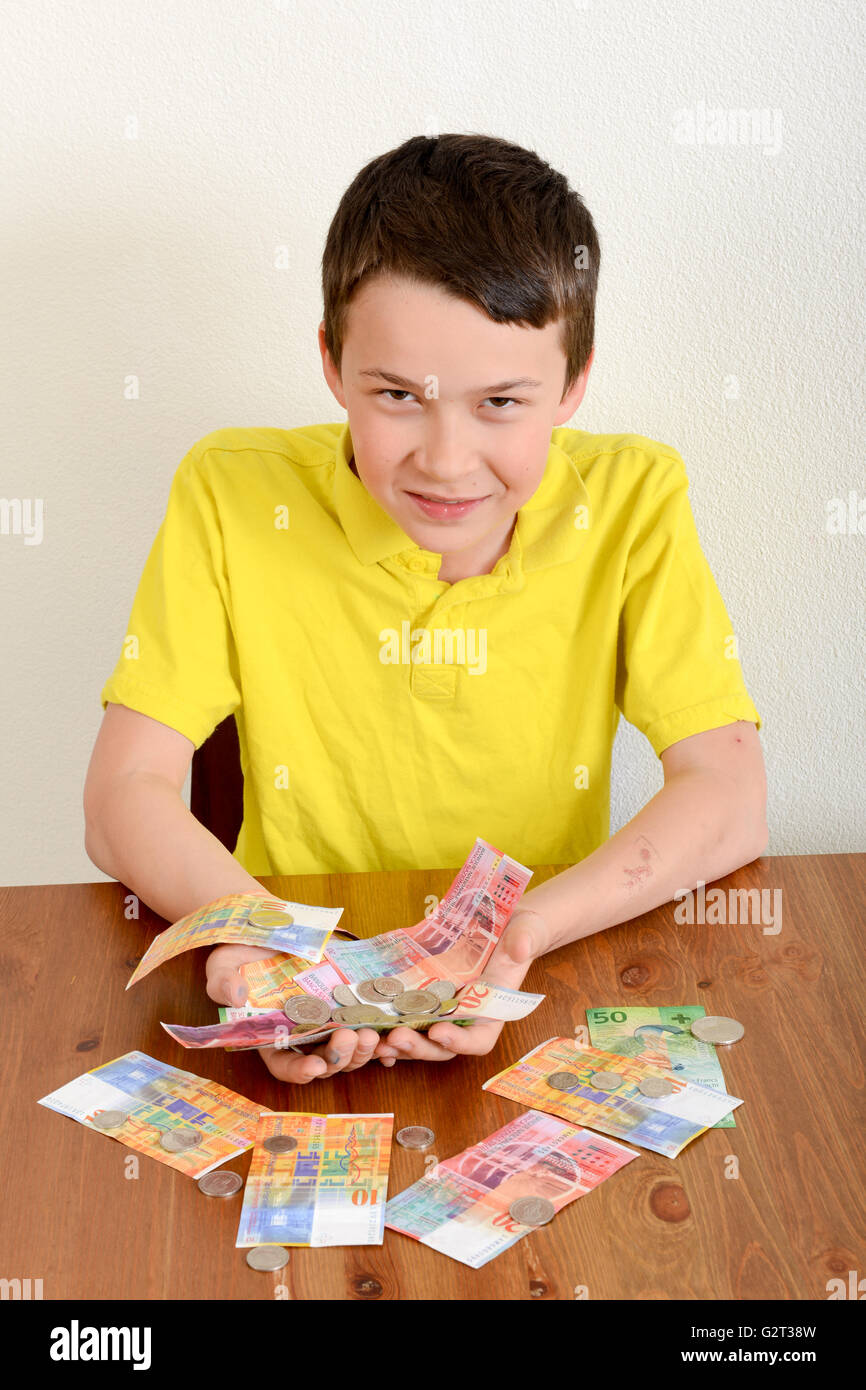 Child showing proudly his money Stock Photo - Alamy