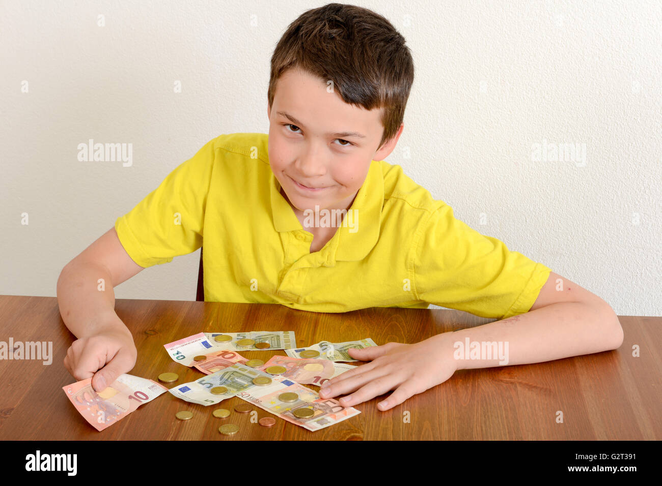 Child showing proudly his money Stock Photo - Alamy