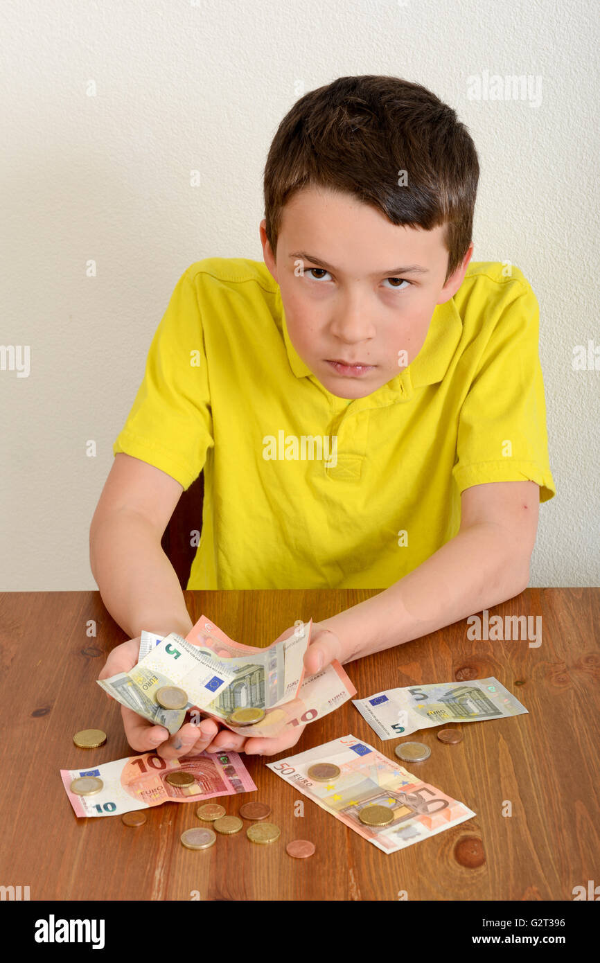 Child showing proudly his money Stock Photo - Alamy
