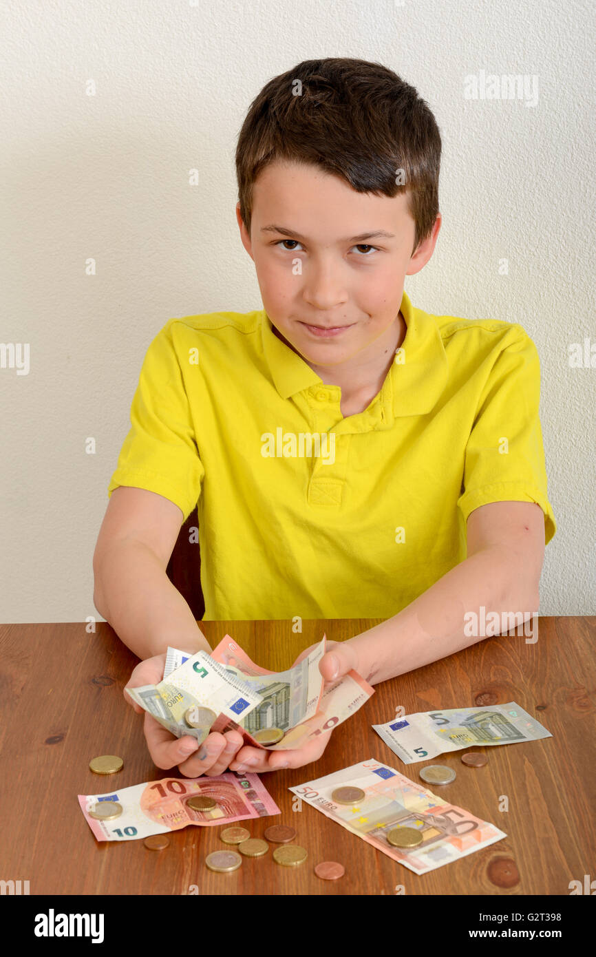 Child showing proudly his money Stock Photo - Alamy