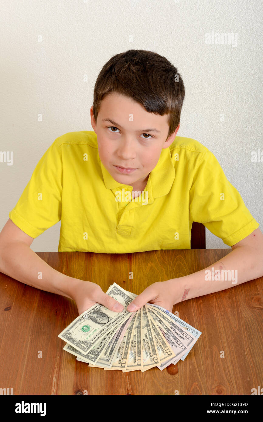 Child showing proudly his money Stock Photo - Alamy
