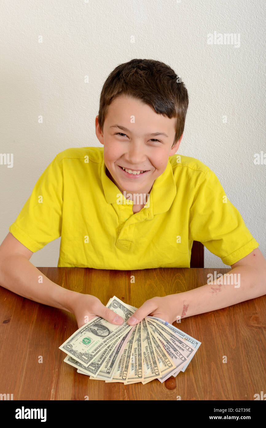 Child holding one dollar bill hi-res stock photography and images - Alamy