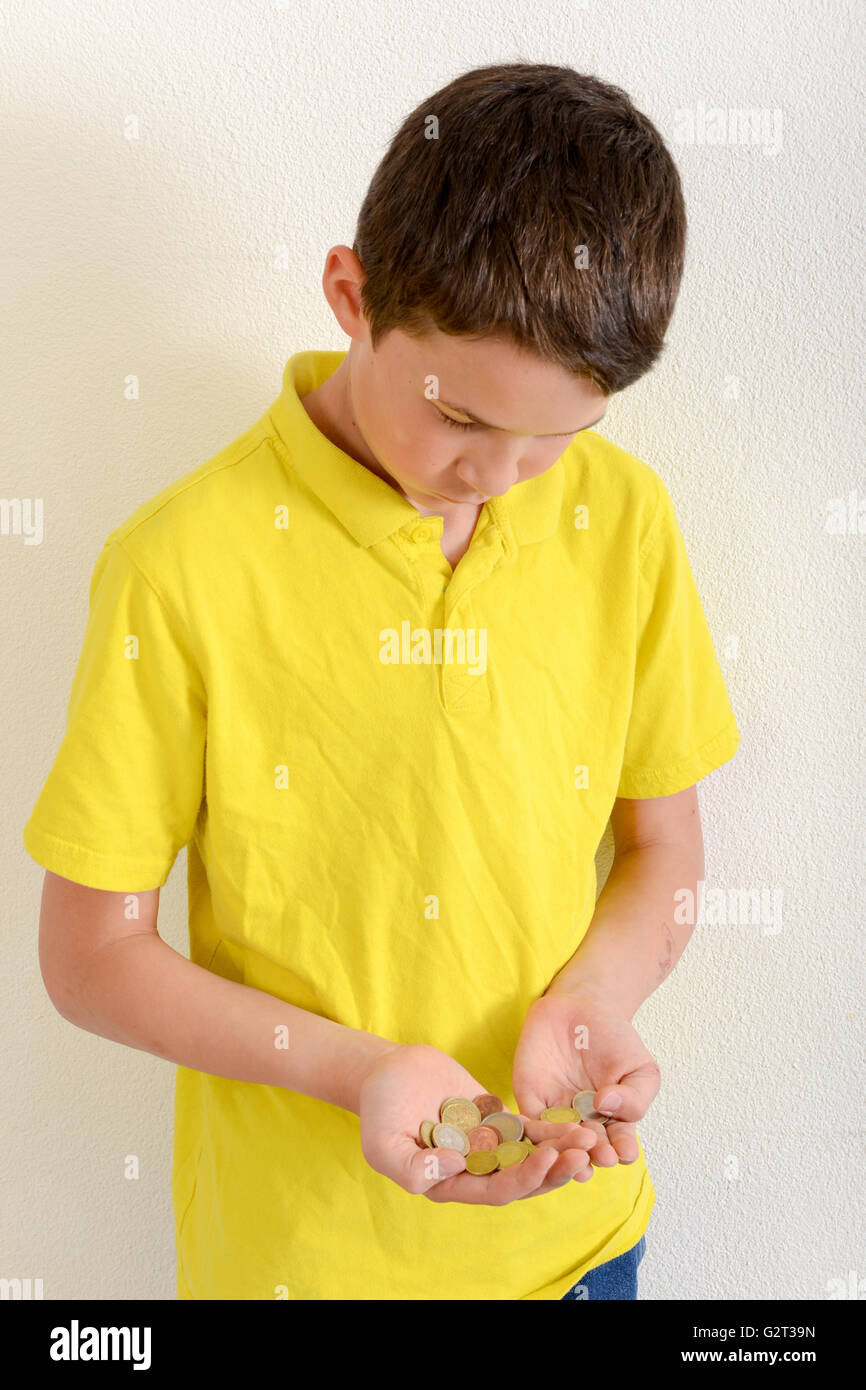 Boy counting coins hi-res stock photography and images - Alamy