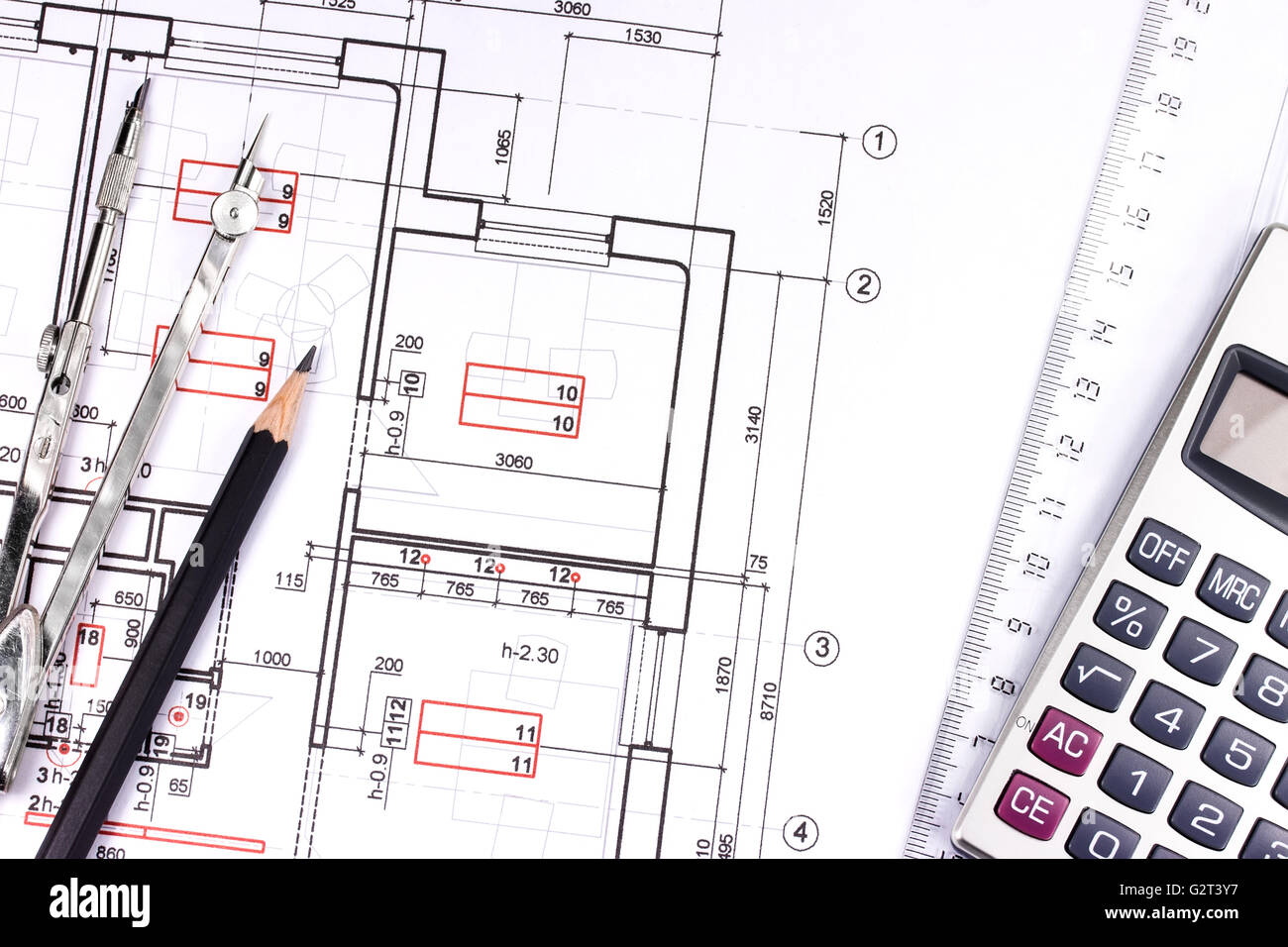 House building construction plans with calculator, pencil and compass ...