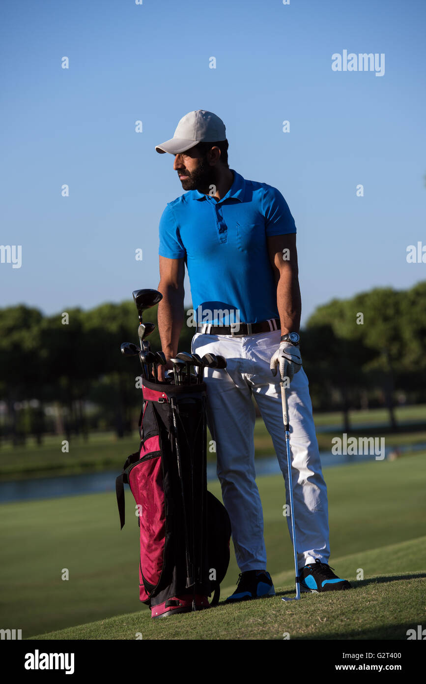 handsome middle eastern golf player portrait at course at sunny day ...