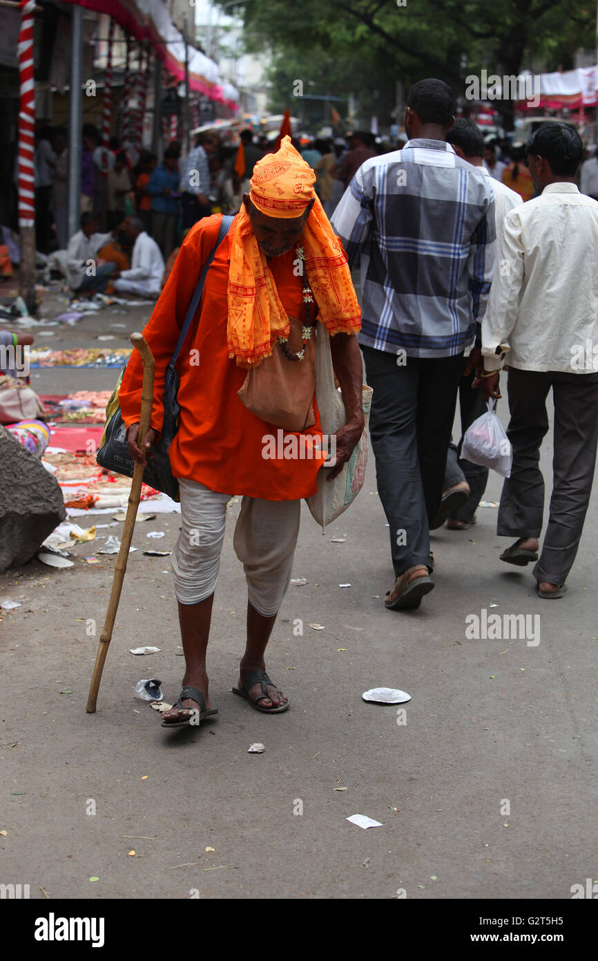 Pune, India - July 11, 2015: An old pilgrim known as warkari walking ...
