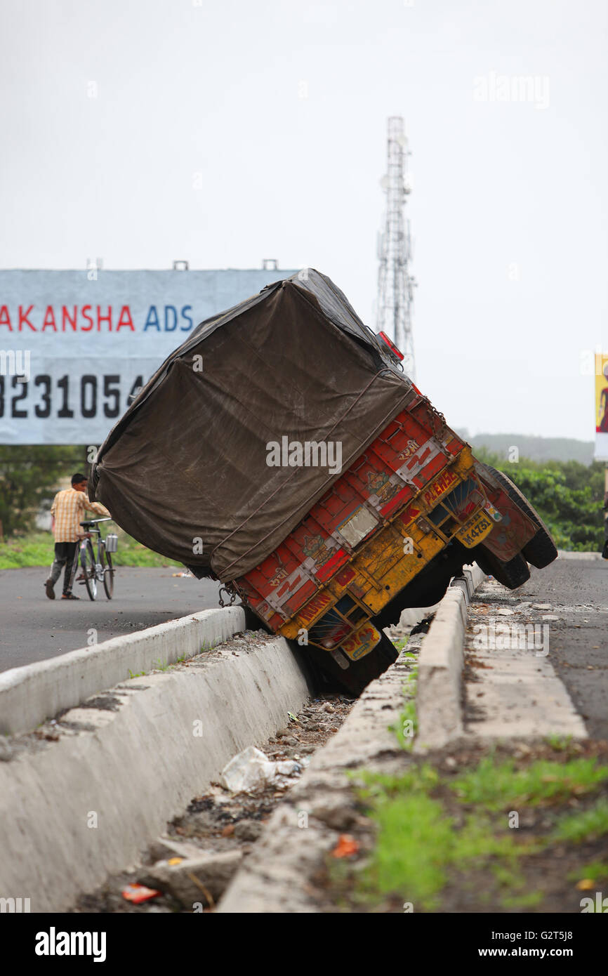 A truck toppled over into a drainage line during a freak accident in ...