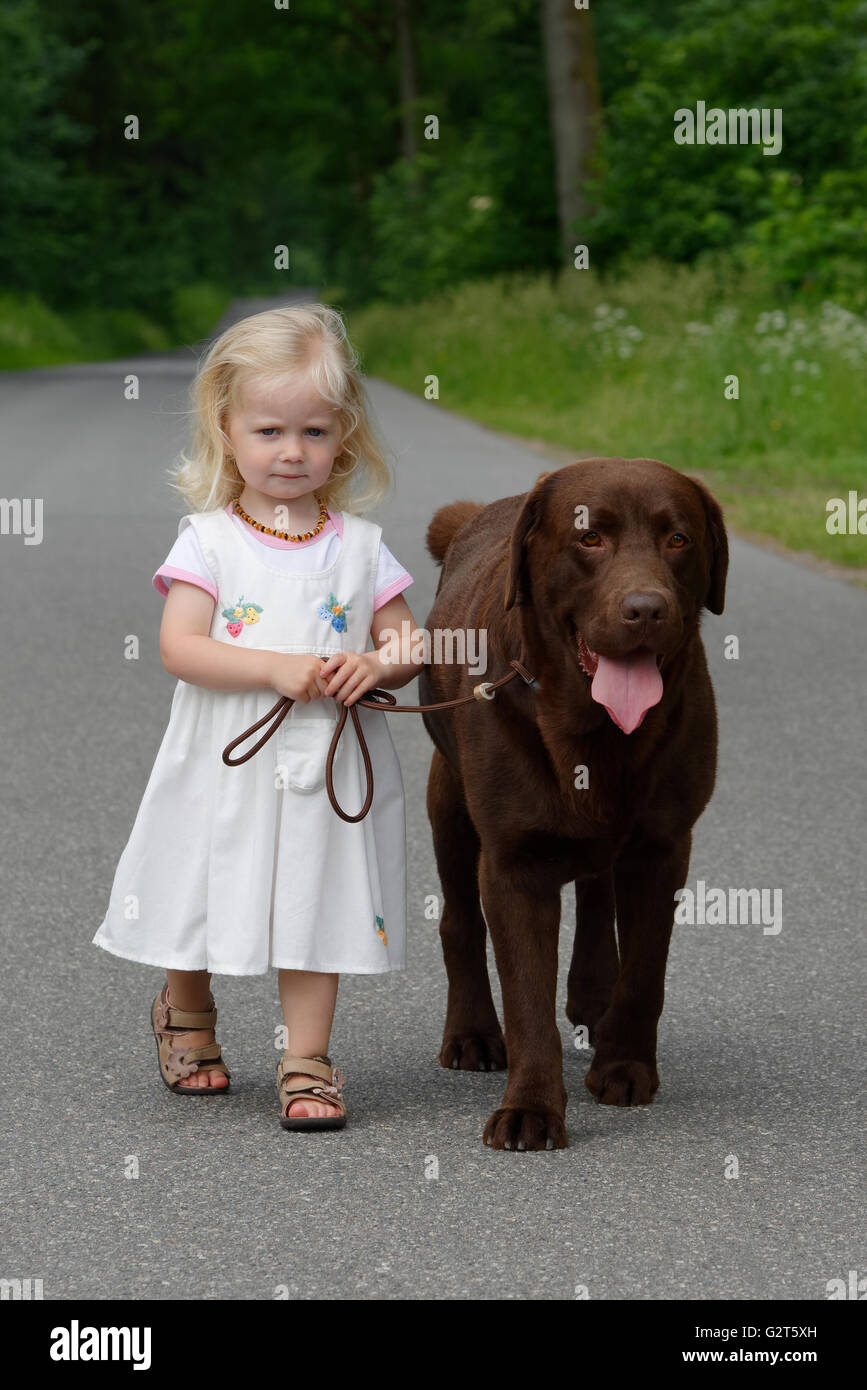 Girl walking dogs hi-res stock photography and images - Alamy