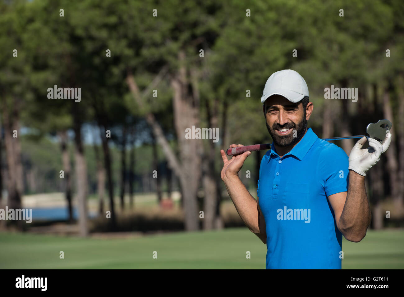 handsome middle eastern golf player portrait at course at sunny day ...