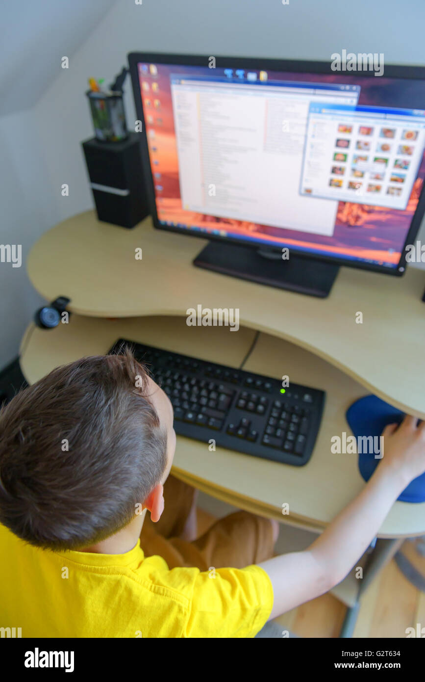 Boy working on computer in his room Stock Photo - Alamy