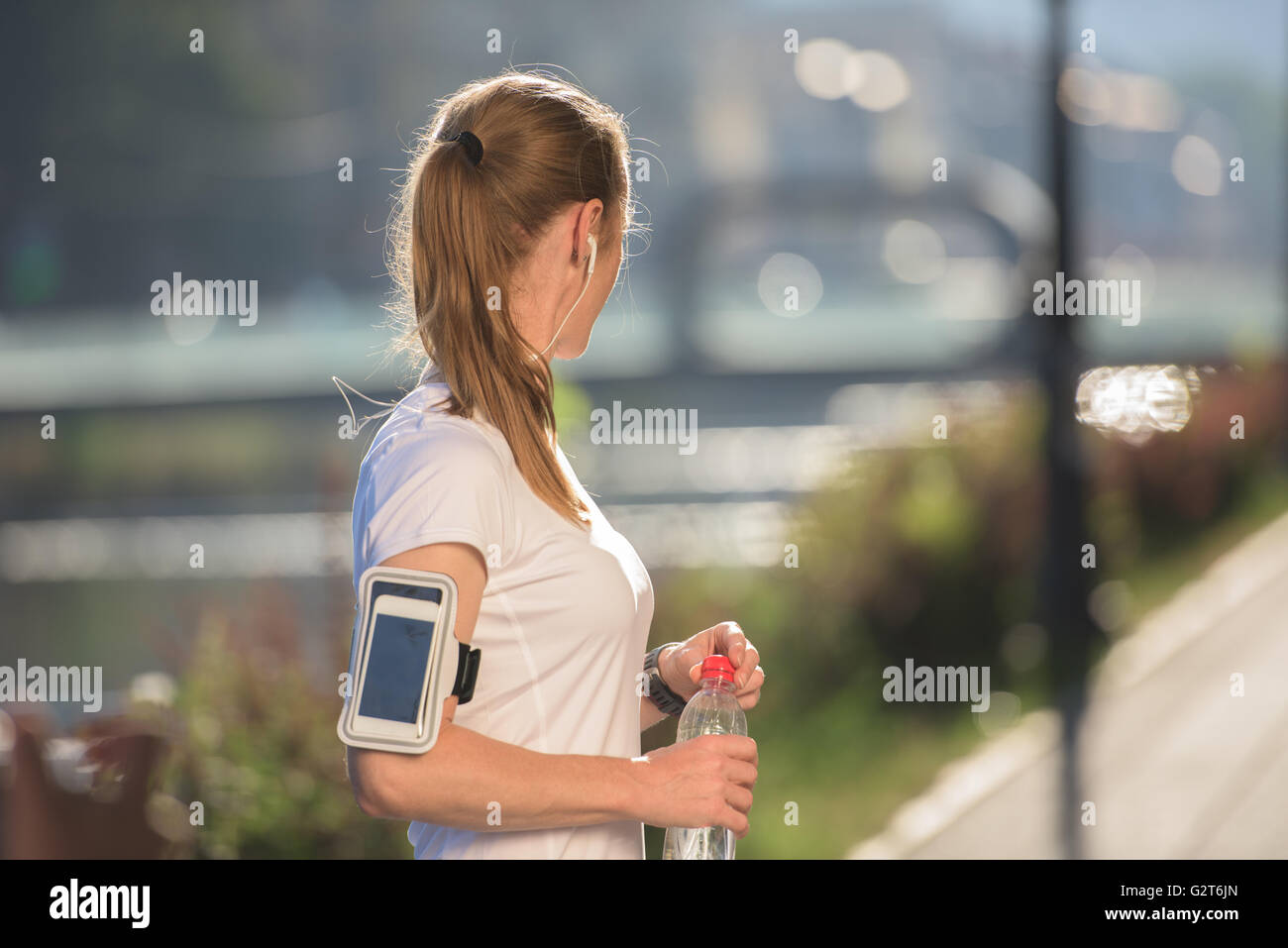 portrait of jogging woman before running on early morning with sunrise ...