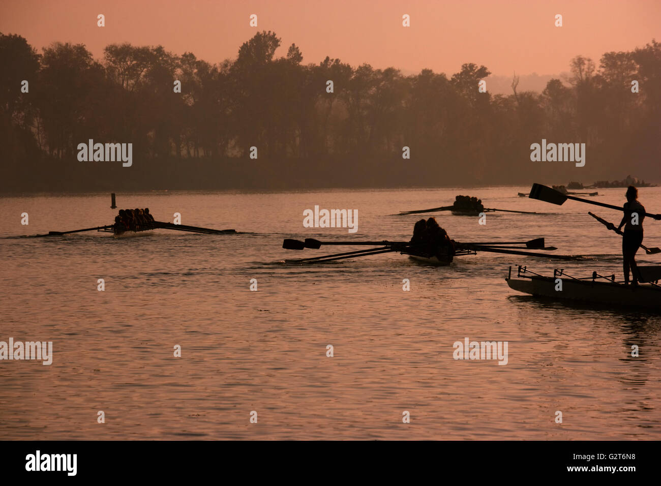 Rowing shells head out at dawn for a collegian crew regatta on the ...
