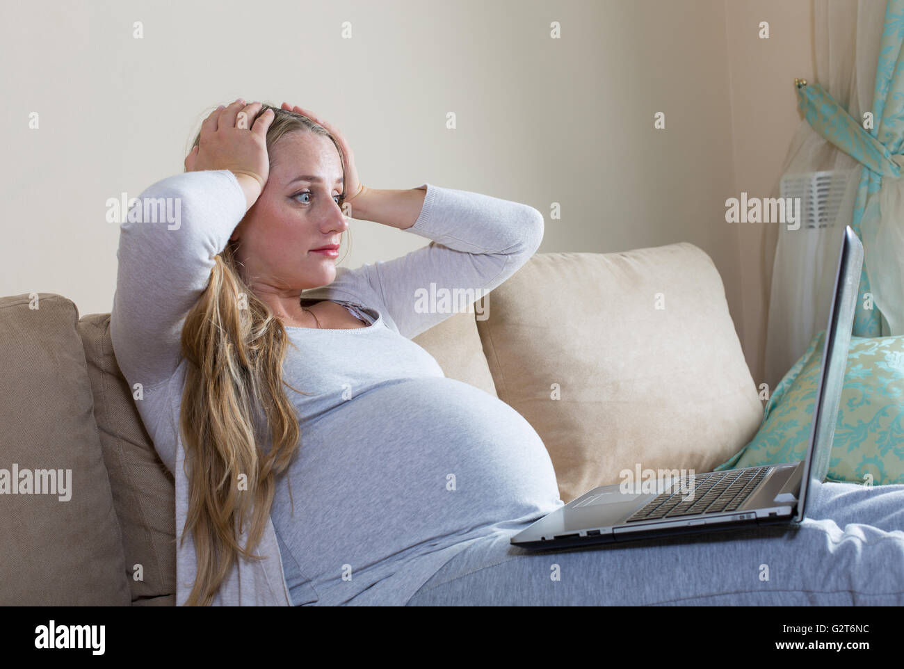 pregnant woman spends time a laptop Stock Photo - Alamy