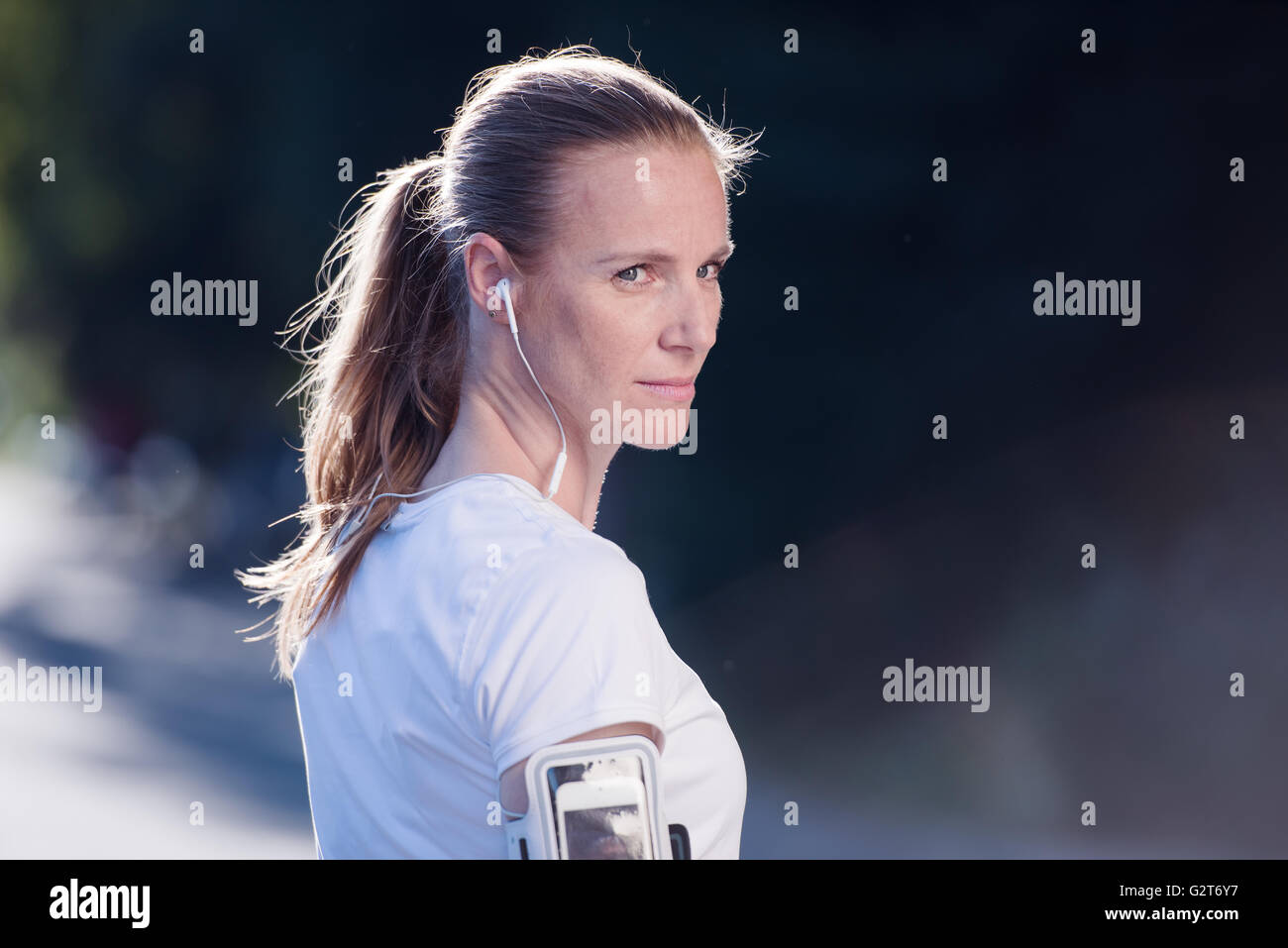 portrait of jogging woman before running on early morning with sunrise ...