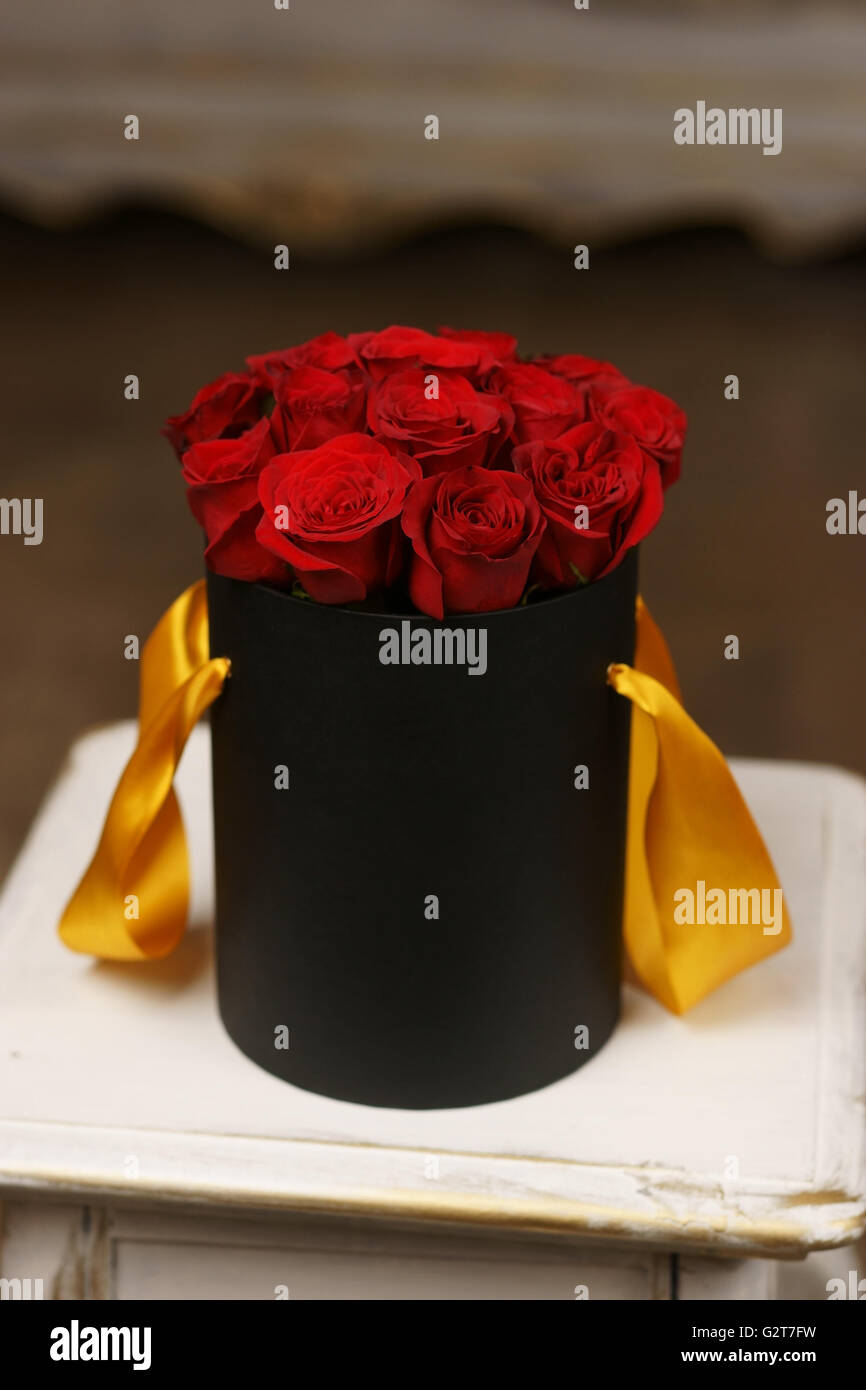 Red roses in black box Stock Photo - Alamy