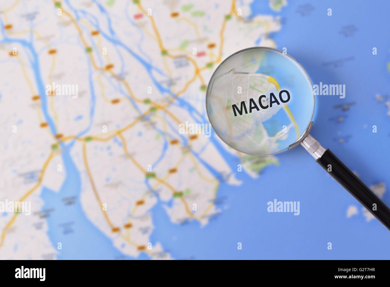 Map of Macao consulted with a magnifying glass highlighting the name of ...