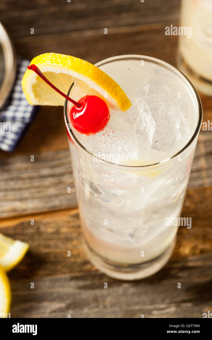 Refreshing Classic Tom Collins Cocktail with a Cherry and Lemon Slice ...