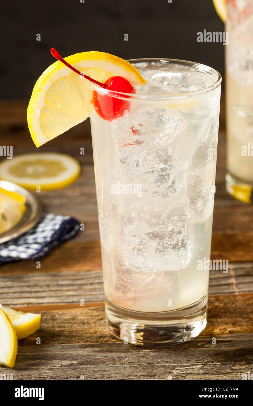 Refreshing Classic Tom Collins Cocktail with a Cherry and Lemon Slice ...