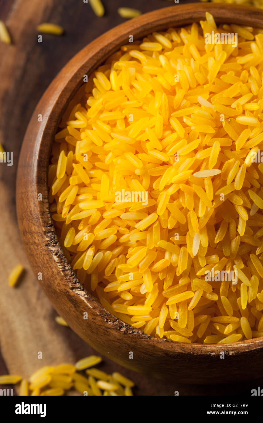 Raw Organic Yellow Saffron Rice in a Bowl Stock Photo - Alamy