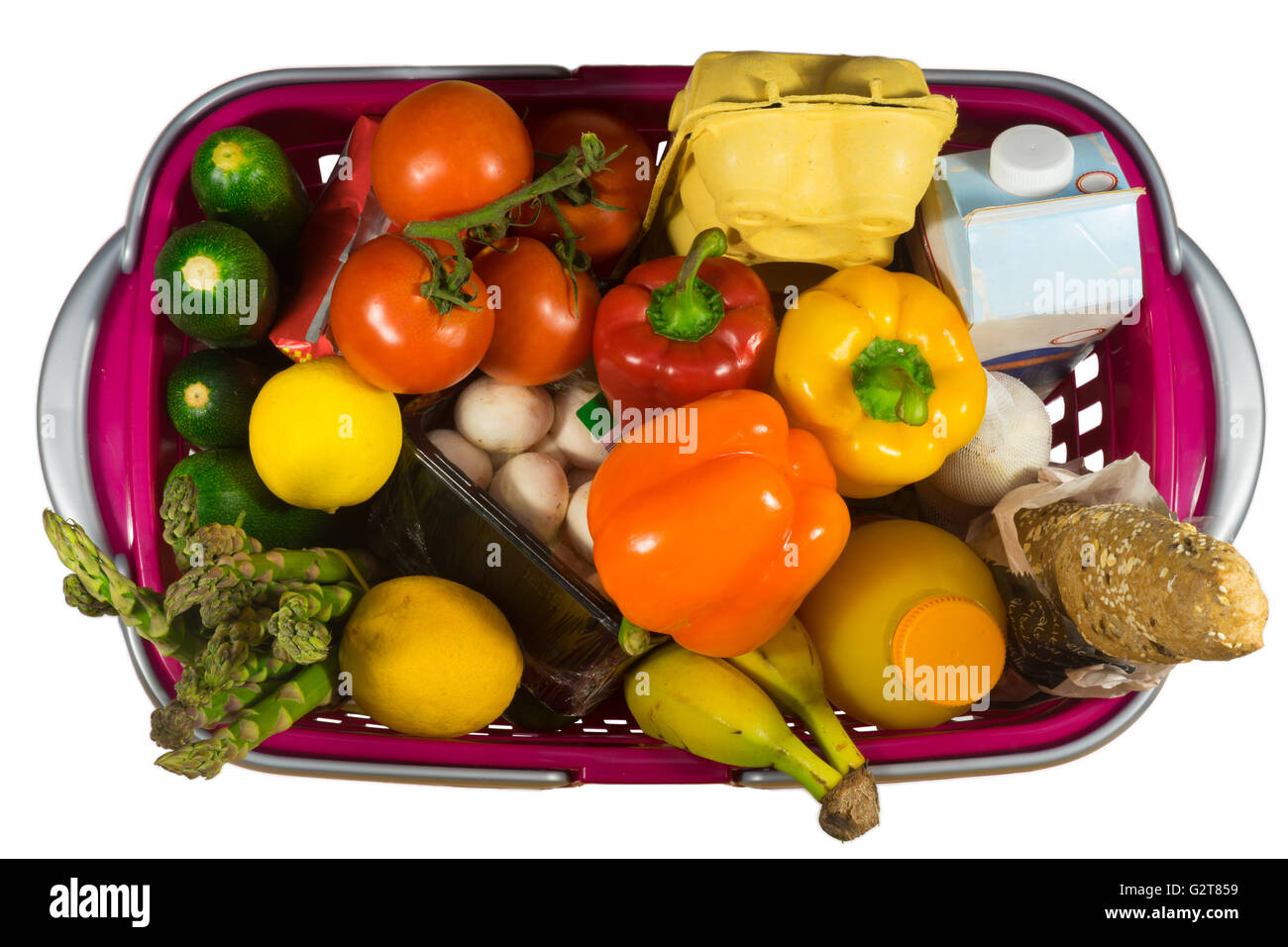 Shopping basket full with food products isolated Stock Photo - Alamy