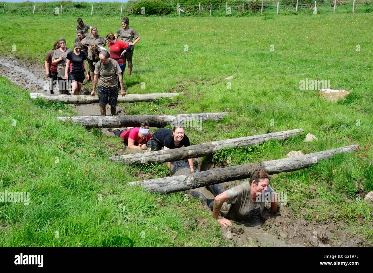 Competitors competing in a fun mud race at the Really wild Festival St ...