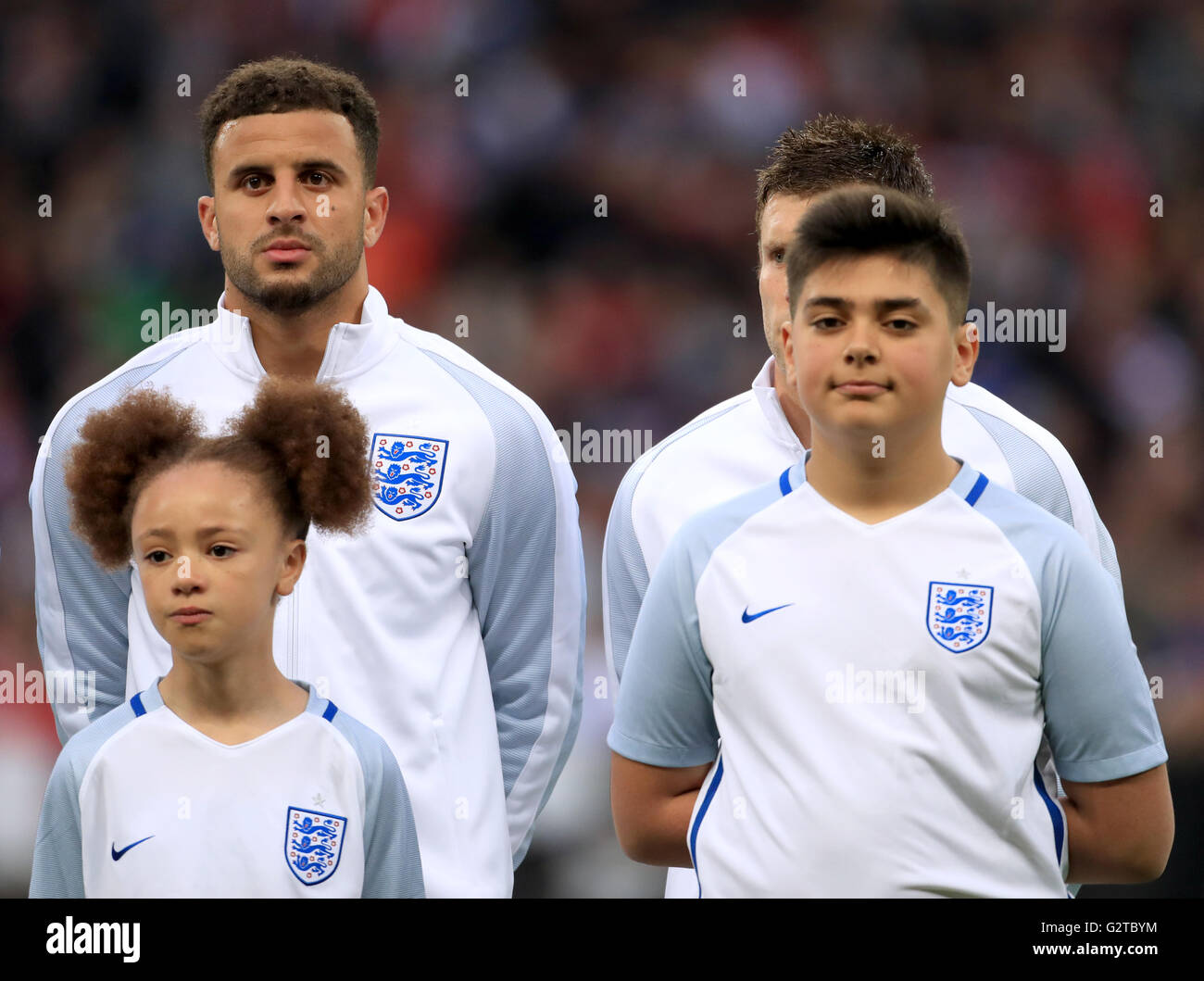 England's Kyle Walker and James Milner (obscured) line up with the ...