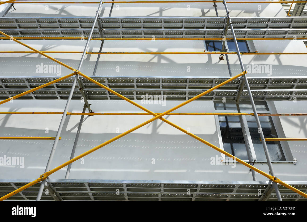scaffolding near a house under construction for external plaster works ...