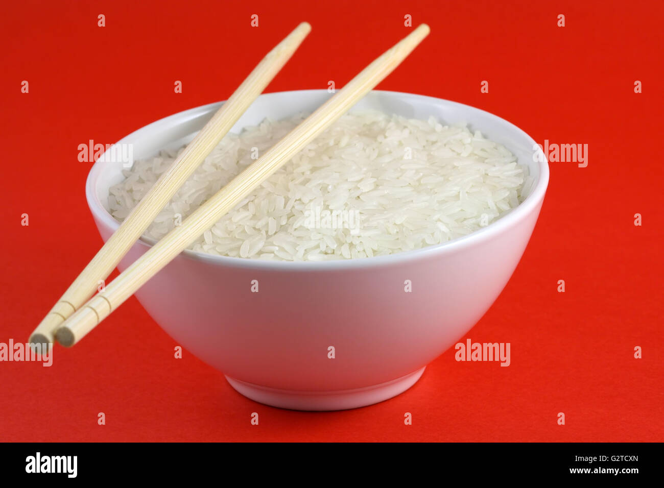 A bowl of rice, red background Stock Photo - Alamy