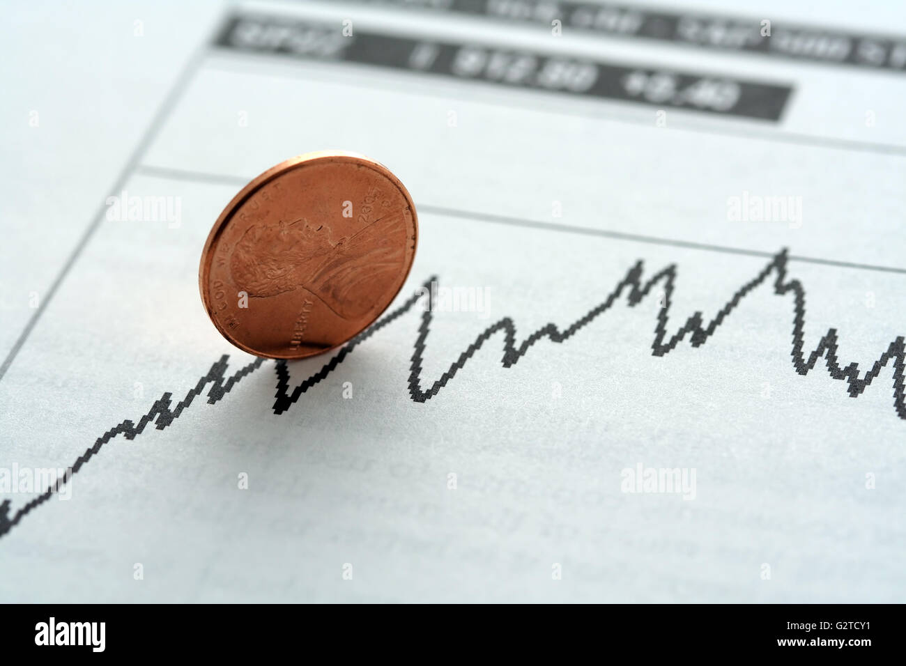 Stock graph with upward trend, symbolized with a penny Stock Photo - Alamy